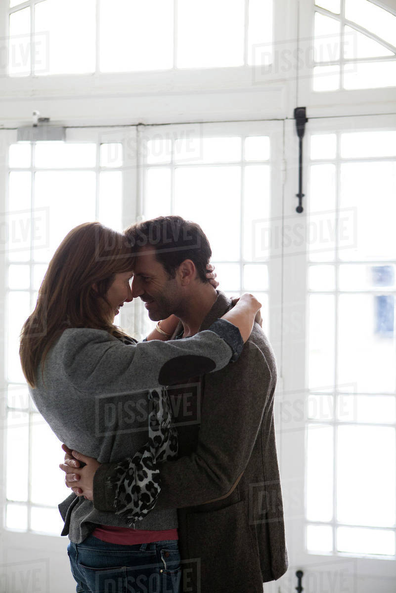 Couple embracing, silhouette - Royalty-free Stock Photo | Dissolve