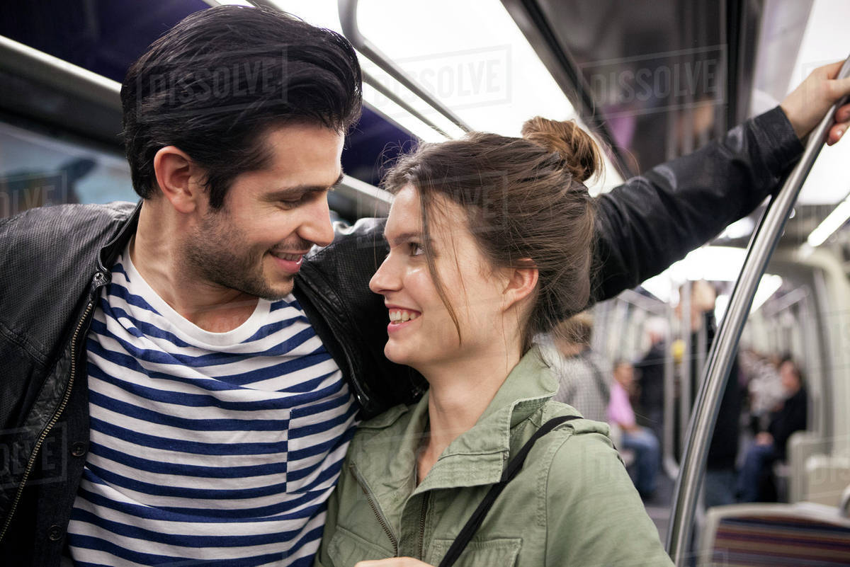 Young couple riding subway together - Royalty-free Stock Photo | Dissolve