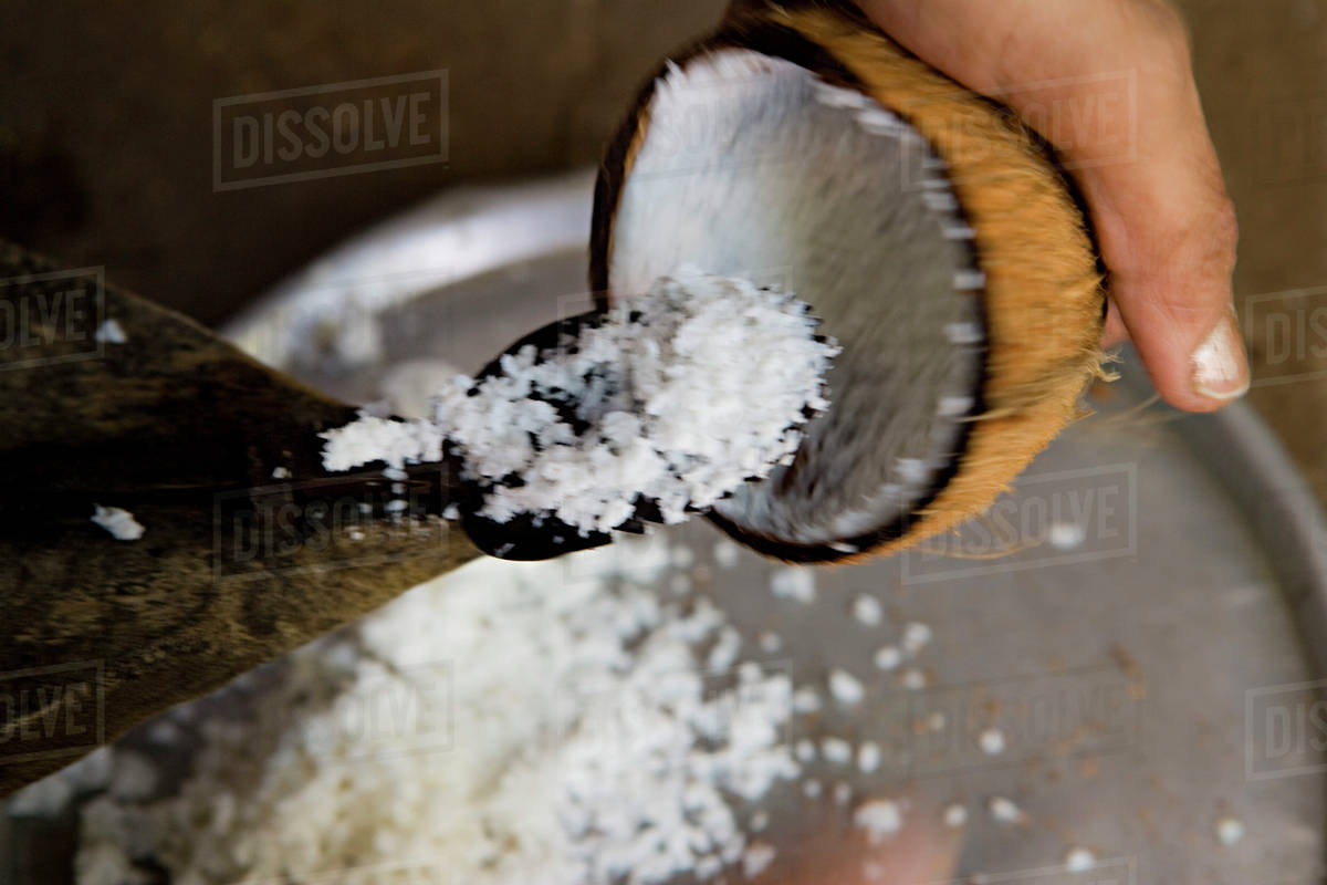 Grating fresh coconut - Royalty-free Stock Photo | Dissolve
