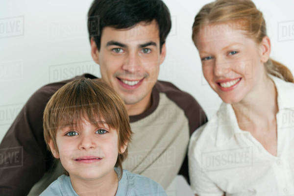 Boy with parents, focus on foreground - Royalty-free Stock Photo | Dissolve