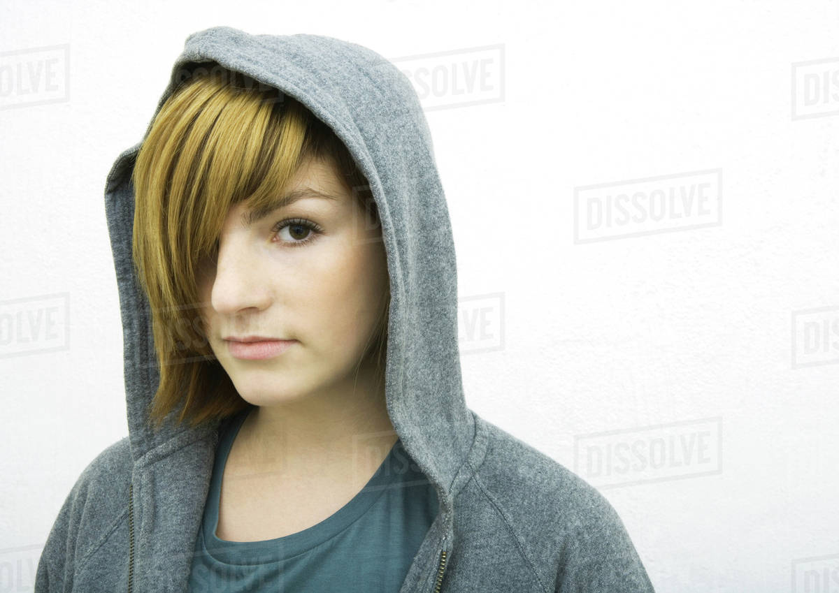 Young woman wearing hood, looking at camera, portrait - Royalty-free ...