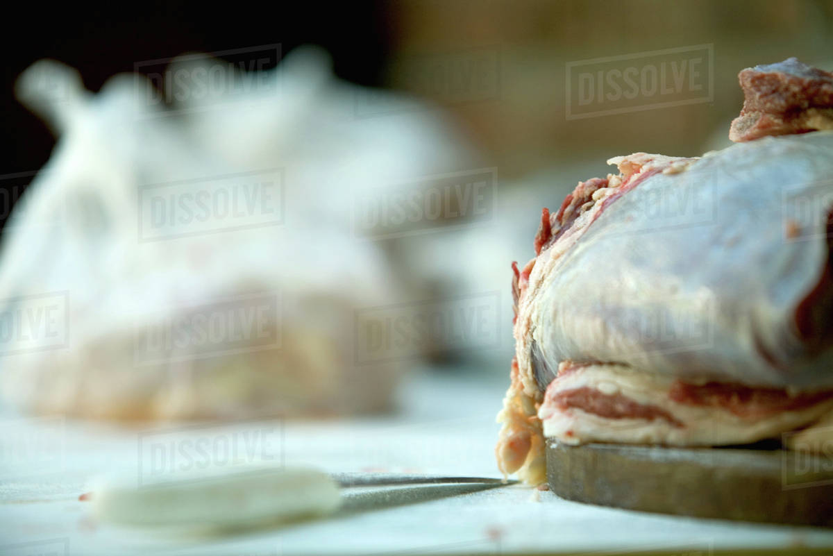 Slab of beef and knife - Royalty-free Stock Photo | Dissolve