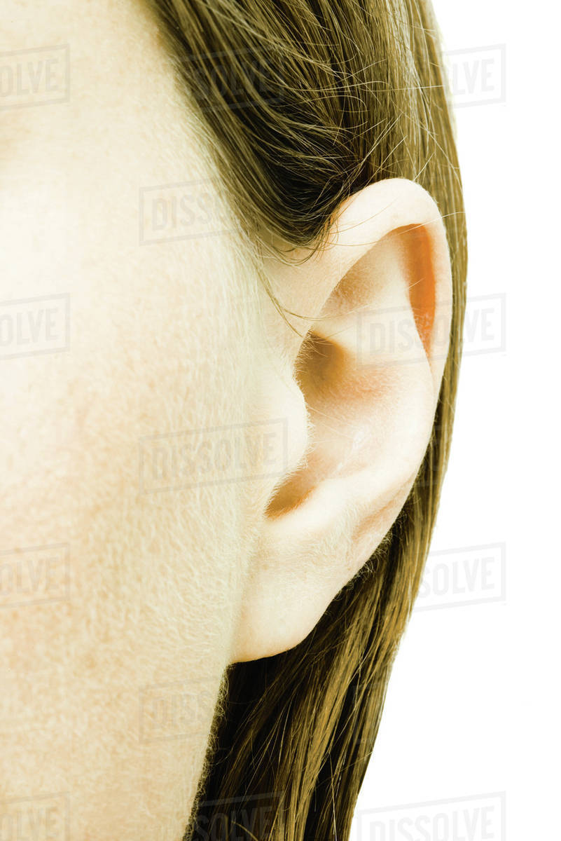 Teenage girl's ear, extreme close-up - Royalty-free Stock Photo | Dissolve
