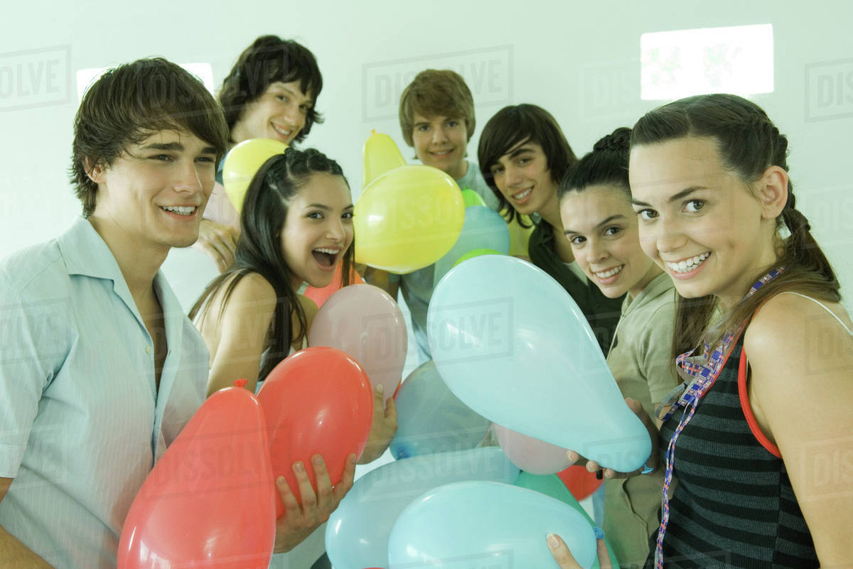 Group of young friends with balloons - Royalty-free Stock Photo | Dissolve