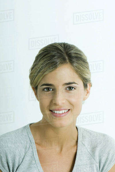 Woman, smiling at camera, portrait - Royalty-free Stock Photo | Dissolve