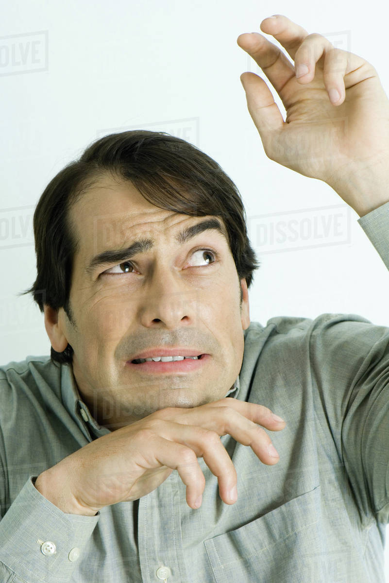Man holding up hands, looking up, portrait - Royalty-free Stock Photo ...