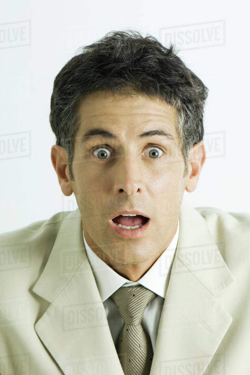 Man making surprised face, portrait - Royalty-free Stock Photo | Dissolve