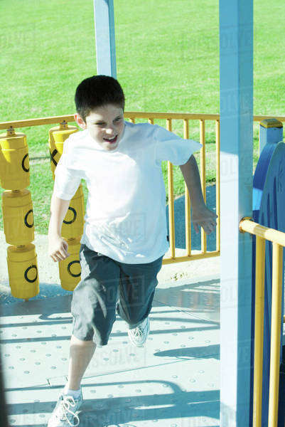 Child on playground equipment - Royalty-free Stock Photo | Dissolve
