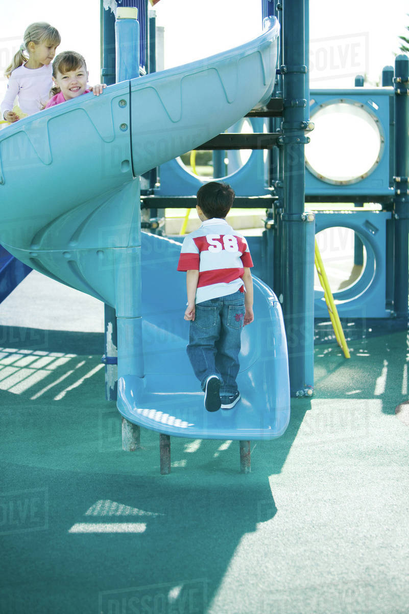 Children on playground equipment - Stock Photo - Dissolve