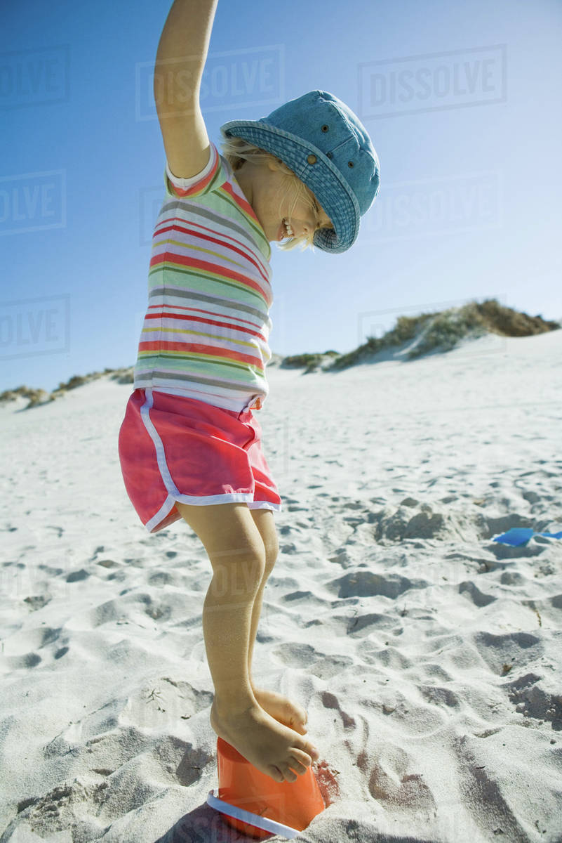 Child playing in sand - Royalty-free Stock Photo | Dissolve