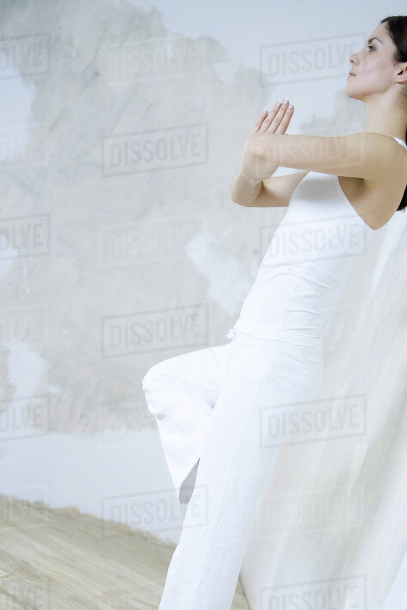 Woman standing in tree pose, side view - Royalty-free Stock Photo ...