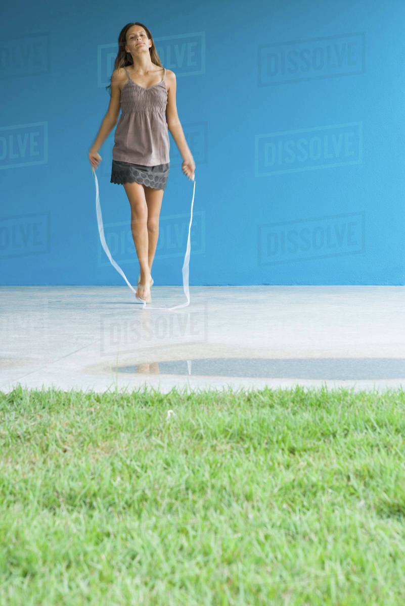 Teenage girl jumping rope, full length - Royalty-free Stock Photo ...
