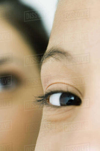 Teenage girl looking at camera, cropped view of eye - Royalty-free ...