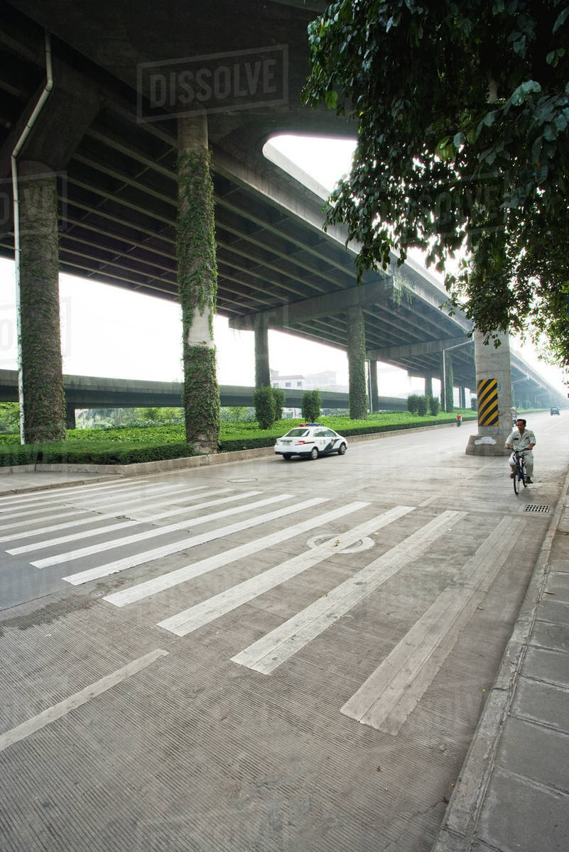 Pedestrian crossing under overpass - Royalty-free Stock Photo | Dissolve