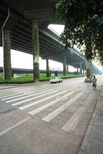 Pedestrian crossing under overpass - Royalty-free Stock Photo | Dissolve
