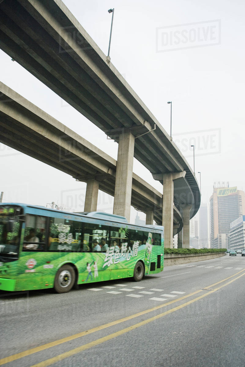 Bus under overpass - Stock Photo - Dissolve