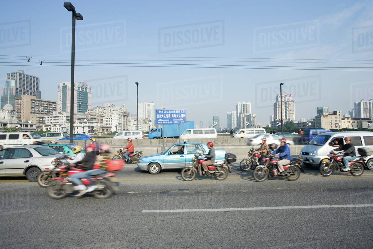 Traffic on city thoroughfare, China - Stock Photo - Dissolve