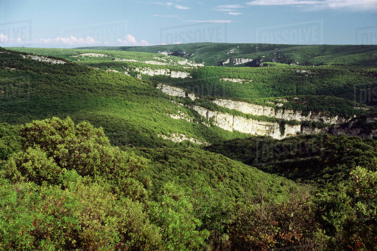 Rolling landscape with white cliffs - Royalty-free Stock Photo | Dissolve