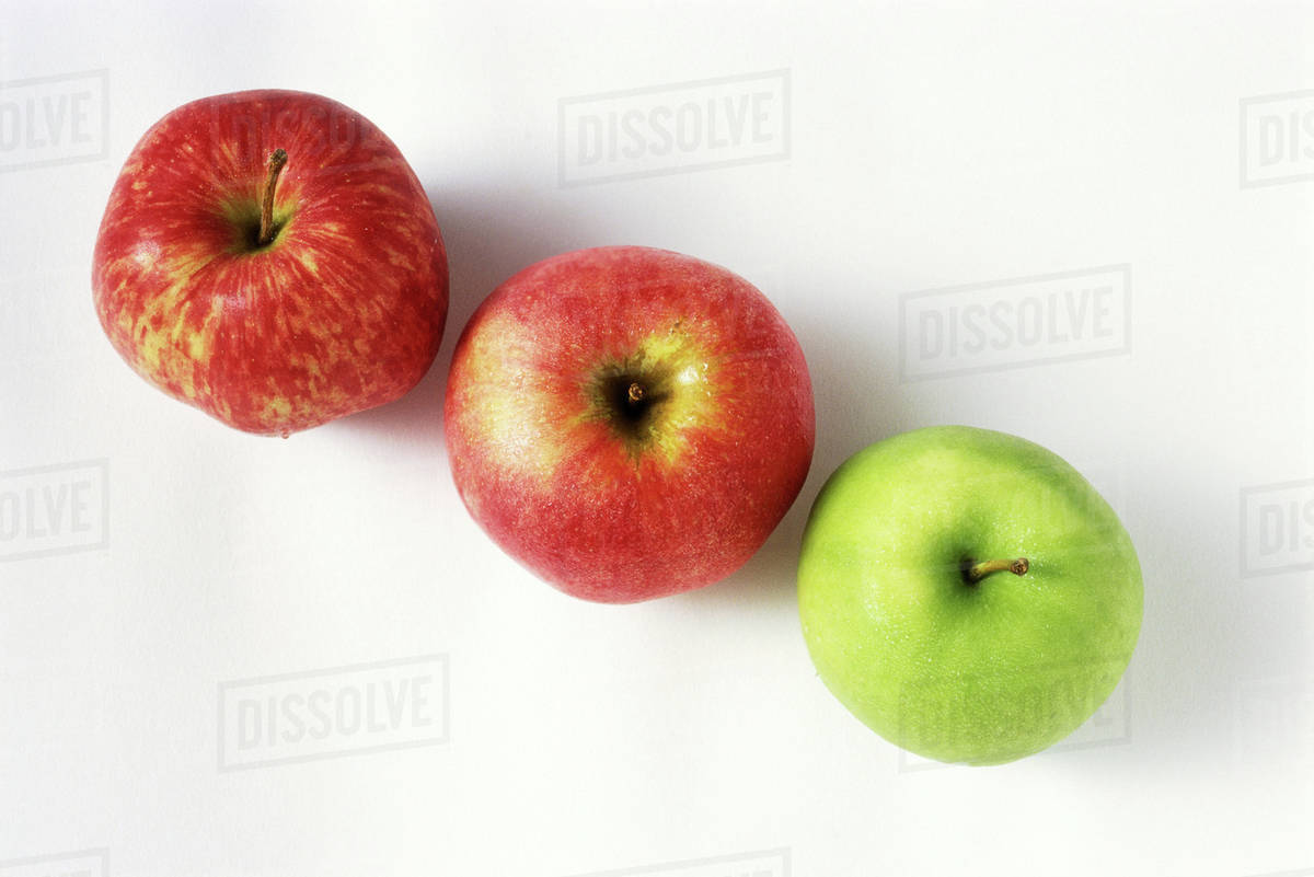 Three apples, viewed from directly above - Stock Photo - Dissolve