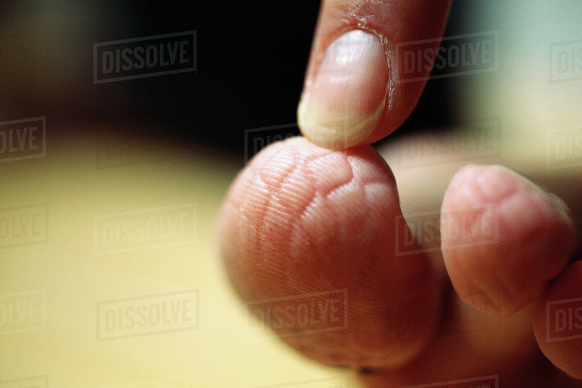 Finger touching toe with imprinted pattern, extreme close-up - Royalty ...