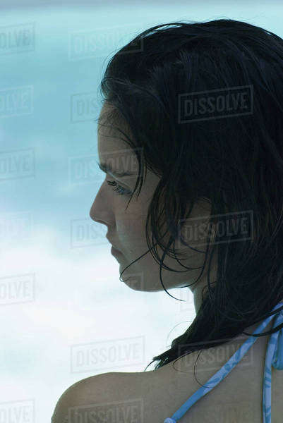 Woman wearing bathing suit, over the shoulder view - Stock Photo - Dissolve