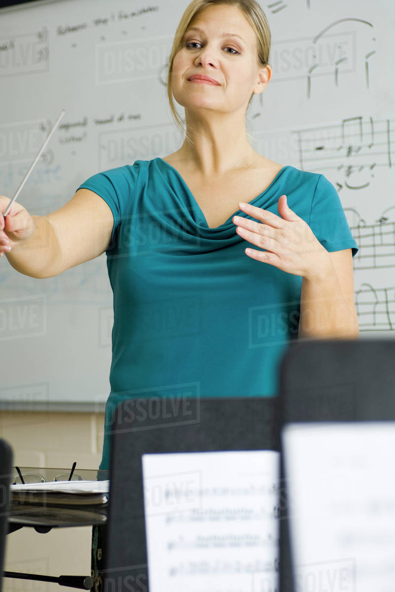 Music teacher conducting - Stock Photo - Dissolve