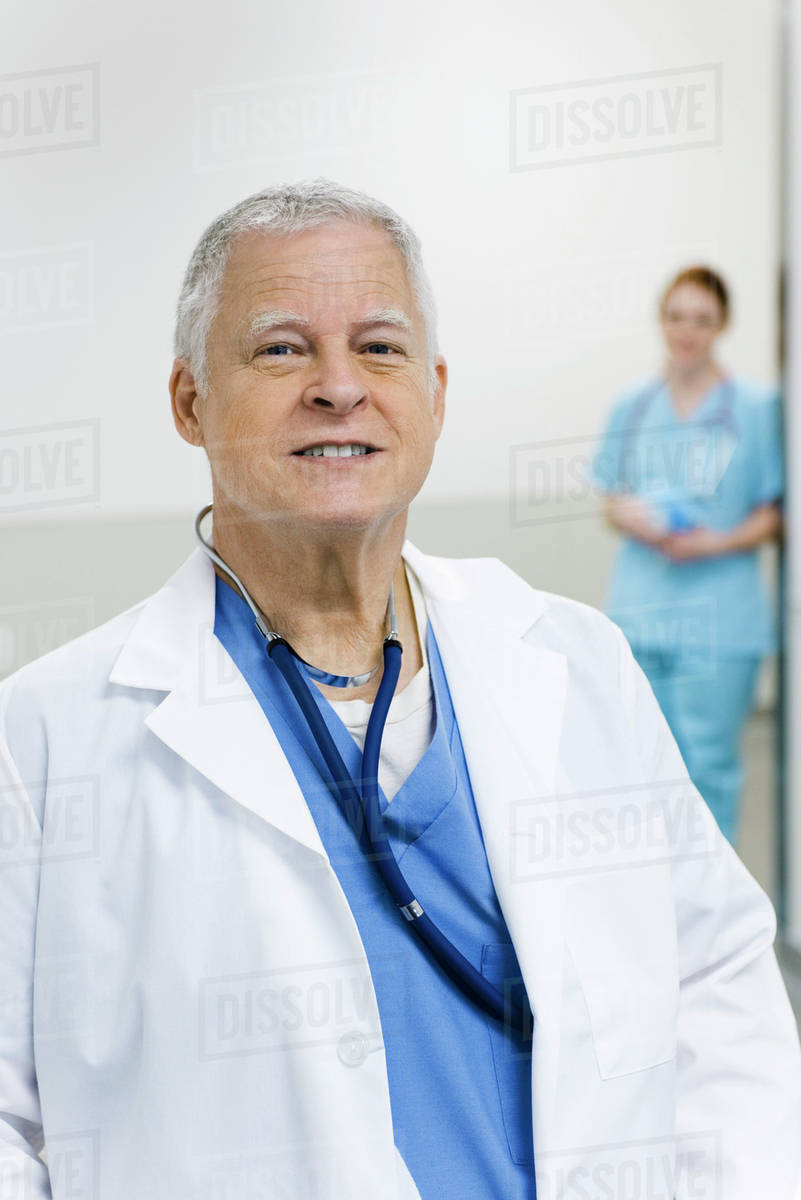 Doctor smiling , portrait - Royalty-free Stock Photo | Dissolve