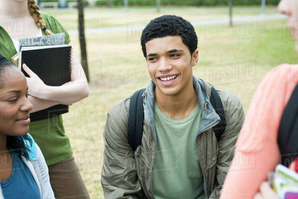 Teenage boy with high school friends, portrait - Stock Photo - Dissolve