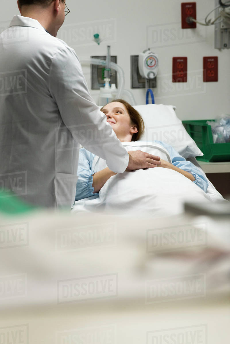 Doctor reassuring patient - Royalty-free Stock Photo | Dissolve
