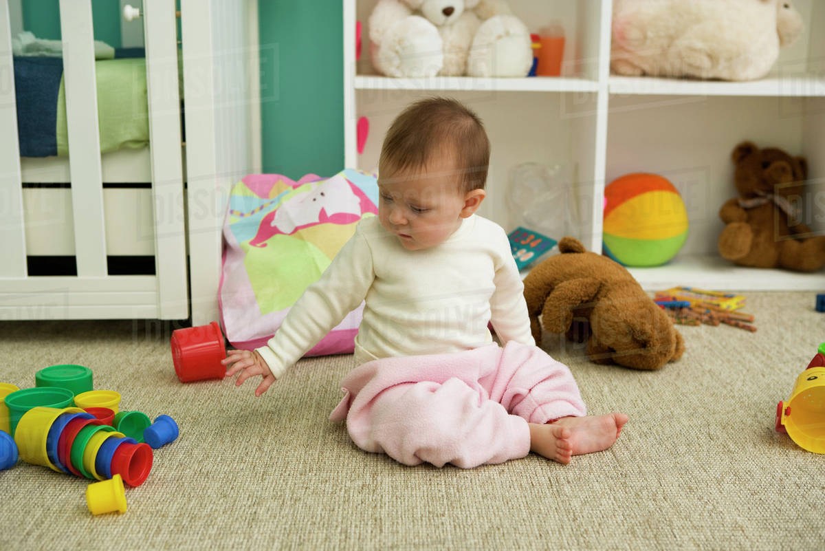 Baby playing in nursery - Royalty-free Stock Photo | Dissolve