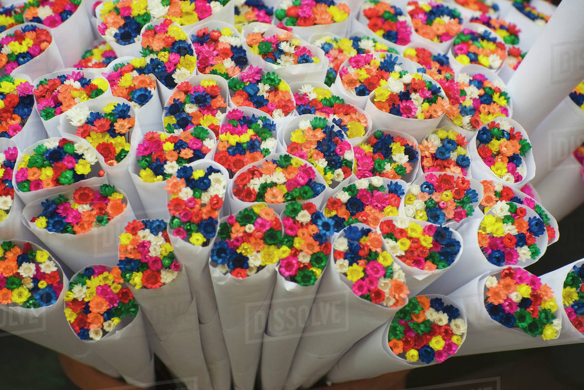 Bouquets of brightly colored dyed flowers - Stock Photo - Dissolve