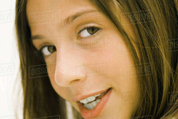 Girl glancing sideways at camera, portrait - Royalty-free Stock Photo ...