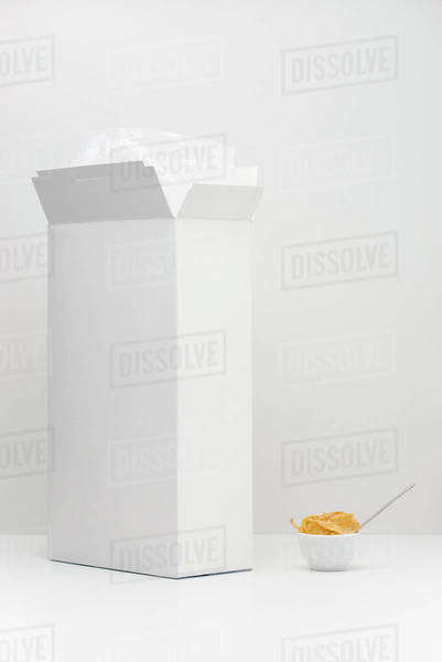 White cereal box and small bowl of cereal - Royalty-free Stock Photo ...
