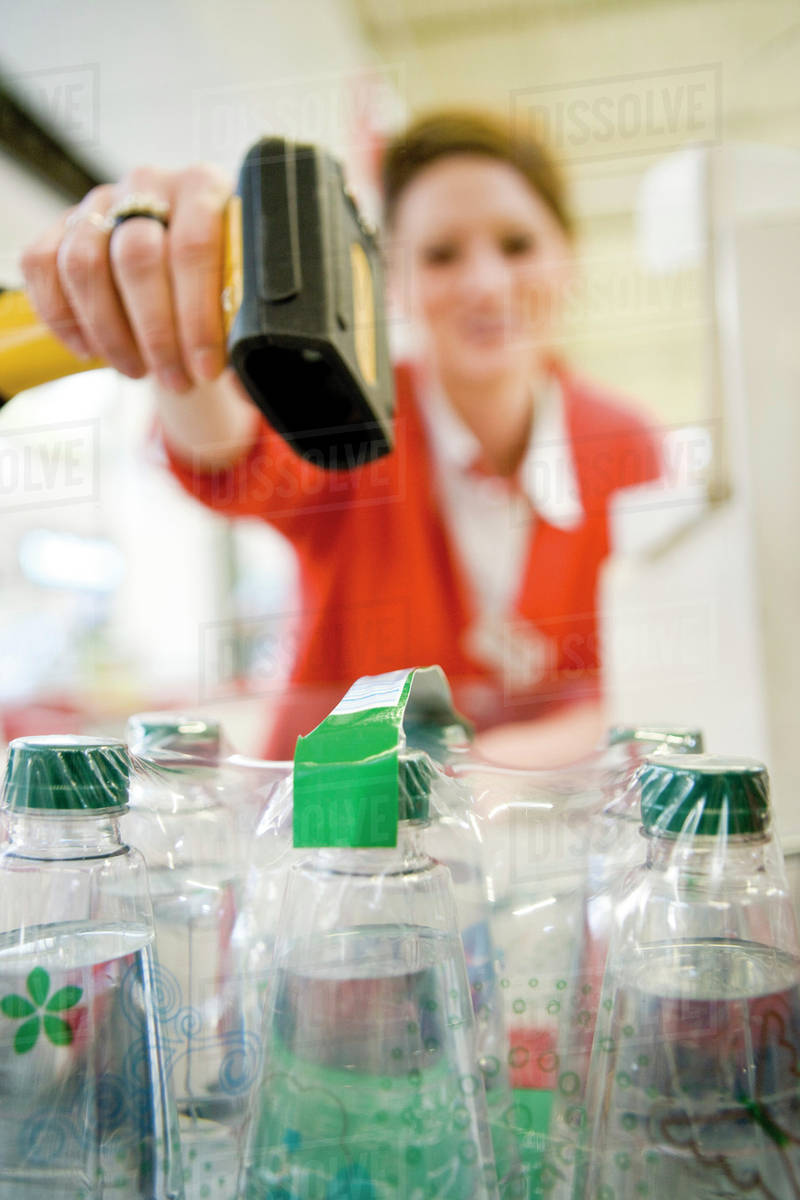 Cashier scanning bar code - Royalty-free Stock Photo | Dissolve