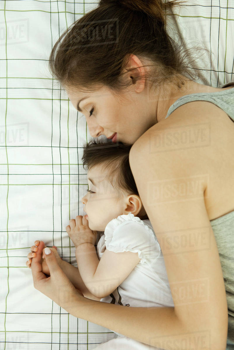 Mother and baby napping together - Royalty-free Stock Photo | Dissolve