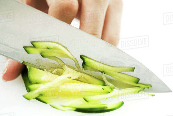 Woman chopping winter squash with knife, cropped view of hand - Royalty ...