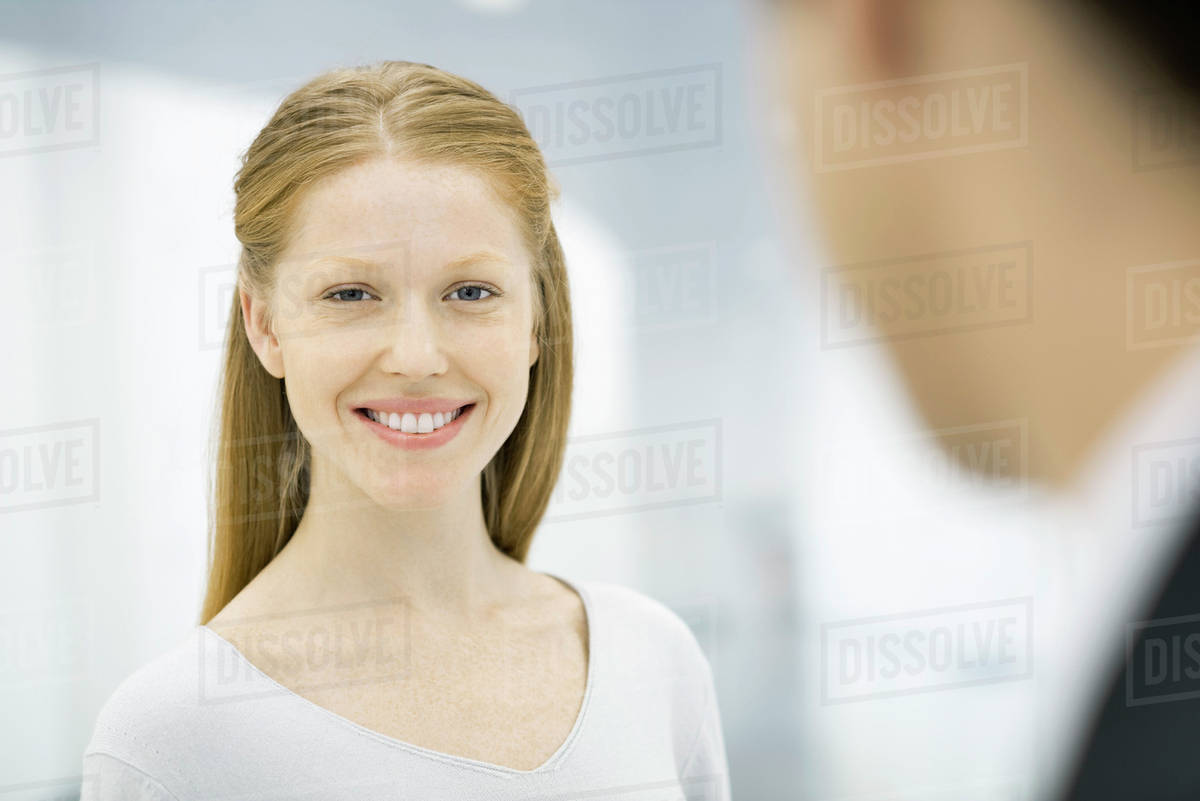 Woman smiling at camera - Royalty-free Stock Photo | Dissolve