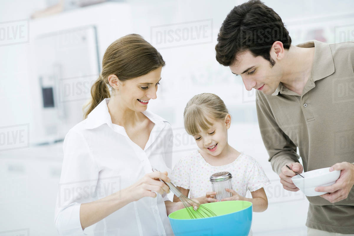 Family cooking together in kitchen - Stock Photo - Dissolve