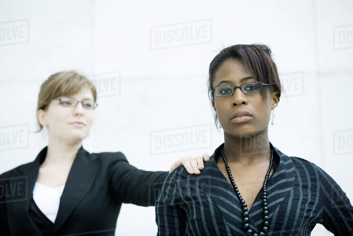 Businesswoman tapping associate on shoulder - Royalty-free Stock Photo ...