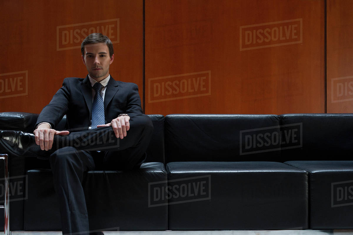 Businessman sitting in waiting room, portrait - Royalty-free Stock ...