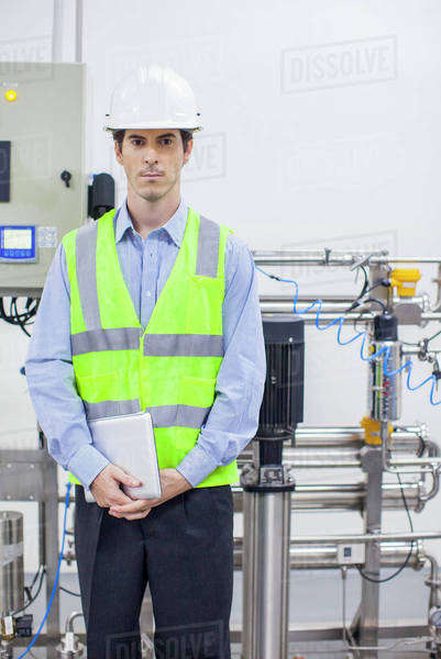 Engineer in industrial plant, portrait - Stock Photo - Dissolve