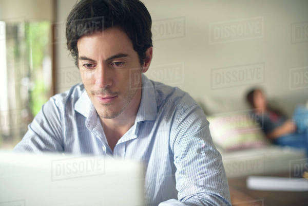 Man using laptop computer - Royalty-free Stock Photo | Dissolve