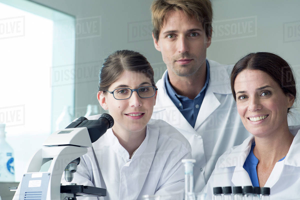 Team of scientists in lab, portrait - Royalty-free Stock Photo | Dissolve