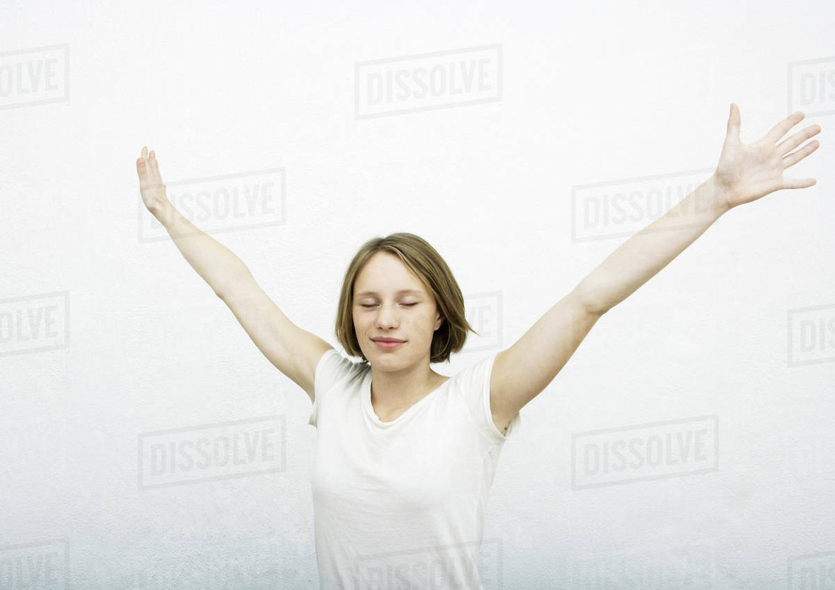 Teenage girl with arms out, eyes closed - Royalty-free Stock Photo ...