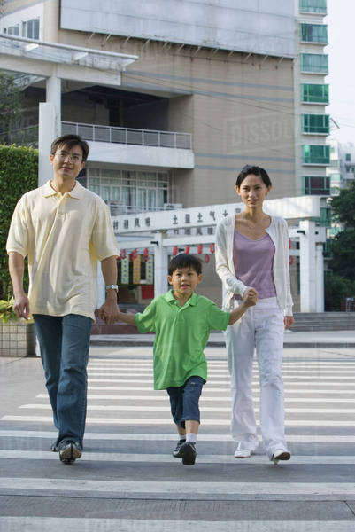 Family crossing crosswalk, holding hands - Royalty-free Stock Photo ...