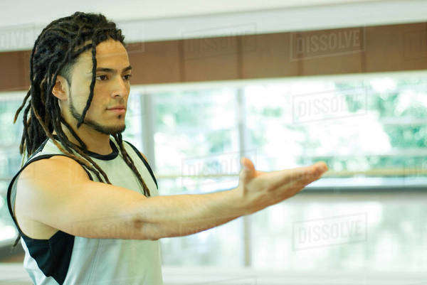 Man reaching out arm, waist up - Royalty-free Stock Photo | Dissolve