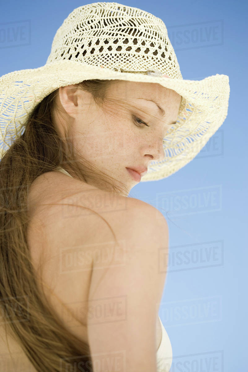 Woman wearing straw hat, low angle view - Royalty-free Stock Photo ...