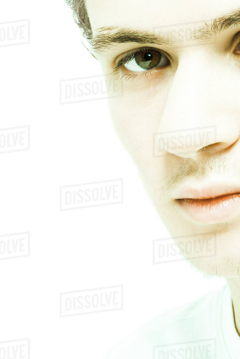 Young man, cropped view of face - Royalty-free Stock Photo | Dissolve