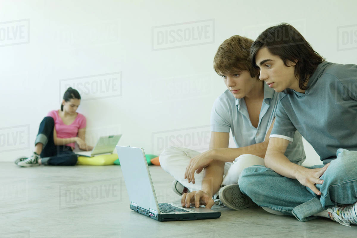 Teenagers using laptops - Royalty-free Stock Photo | Dissolve