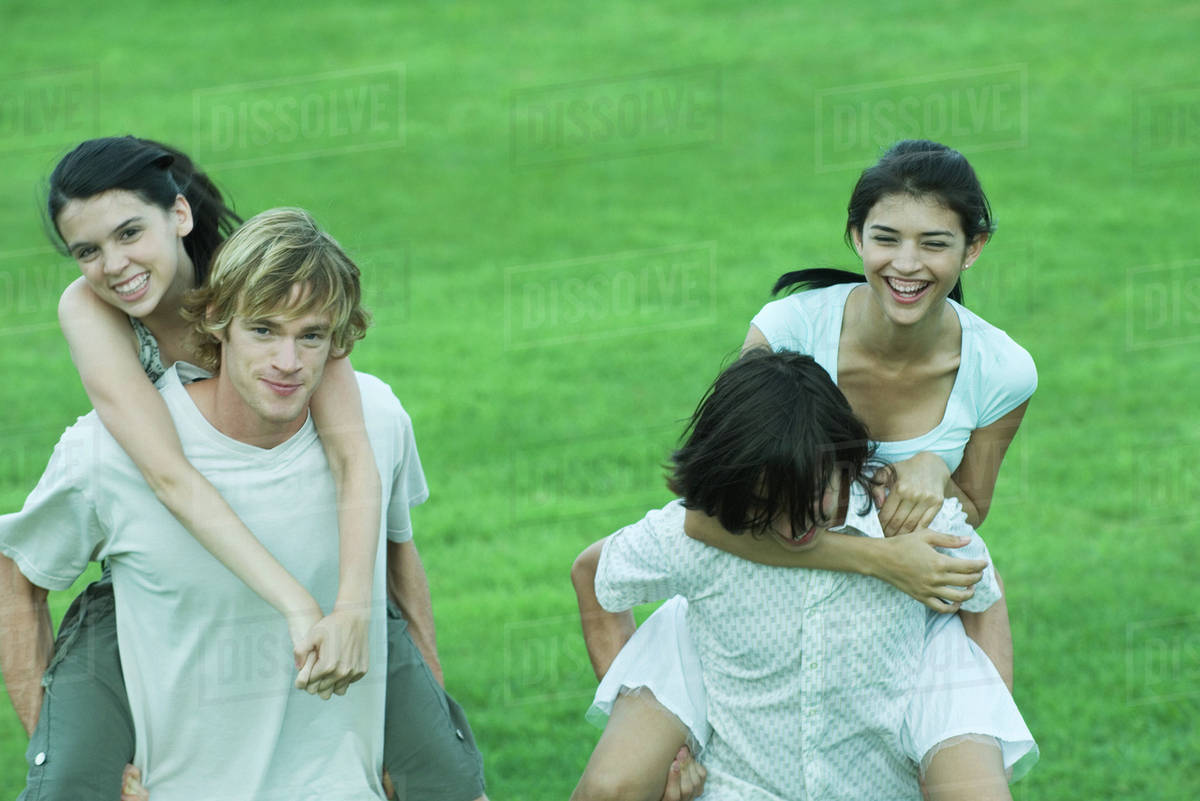 Group of young friends, riding piggyback - Royalty-free Stock Photo ...